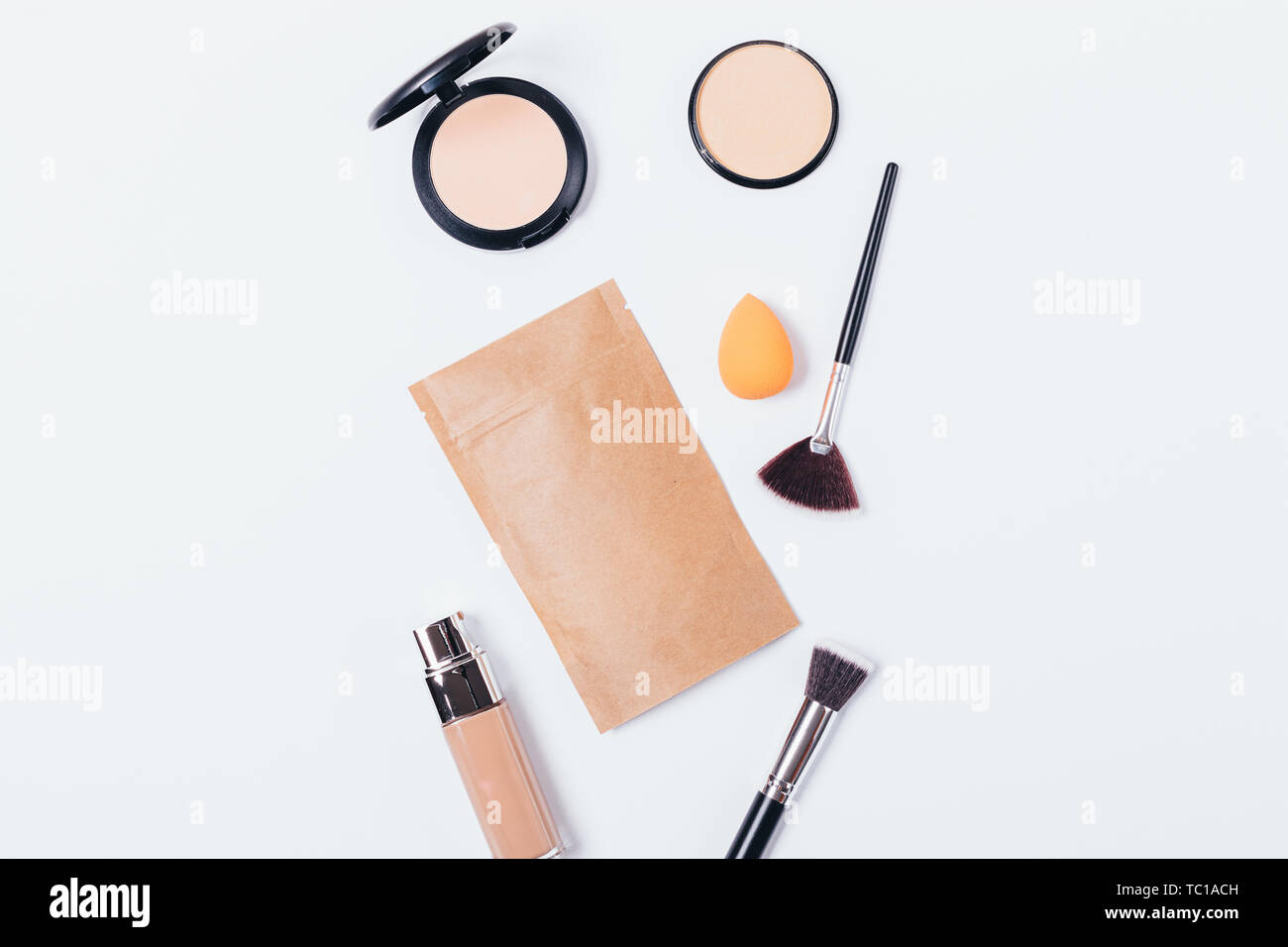 Makeup background of beige cosmetic products, foundation, compact ...