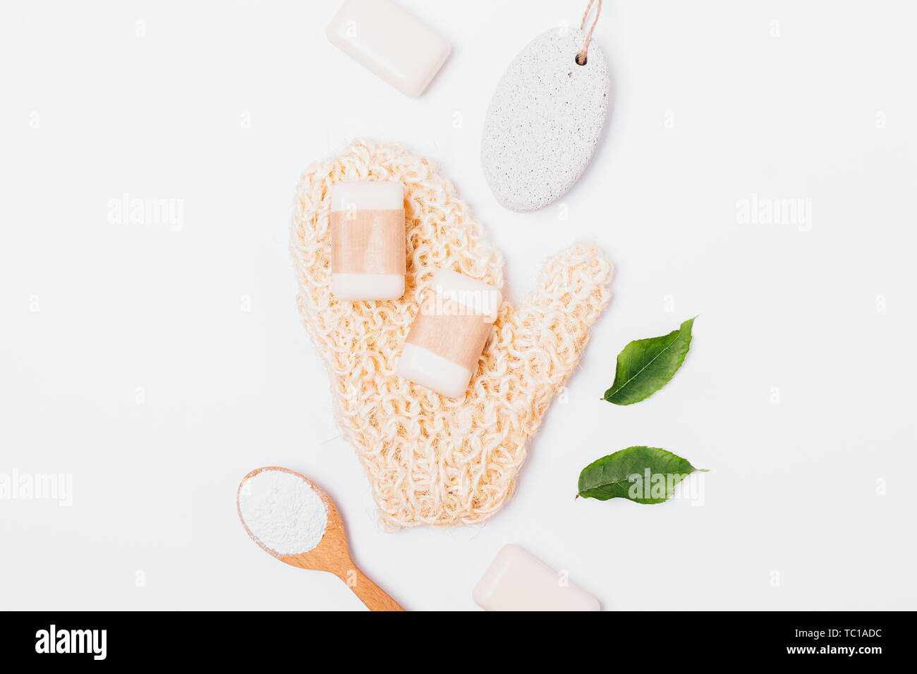 Basic hygiene and body care items on white background. Flat lay natural ...