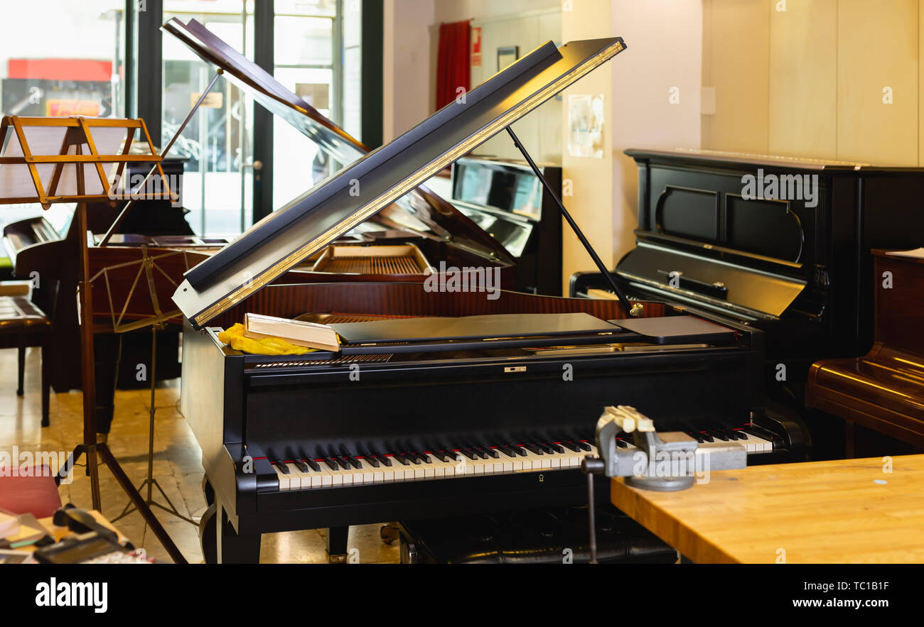 Old elegance musical instruments in a music store Stock Photo - Alamy