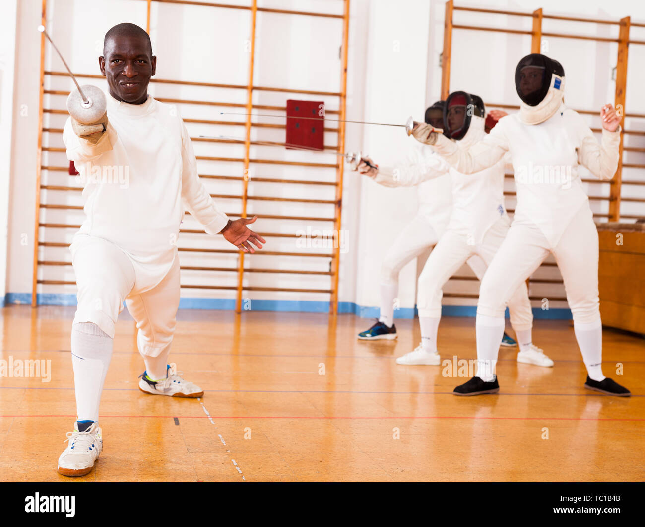 Sporty african american man fencer practicing effective fencing ...