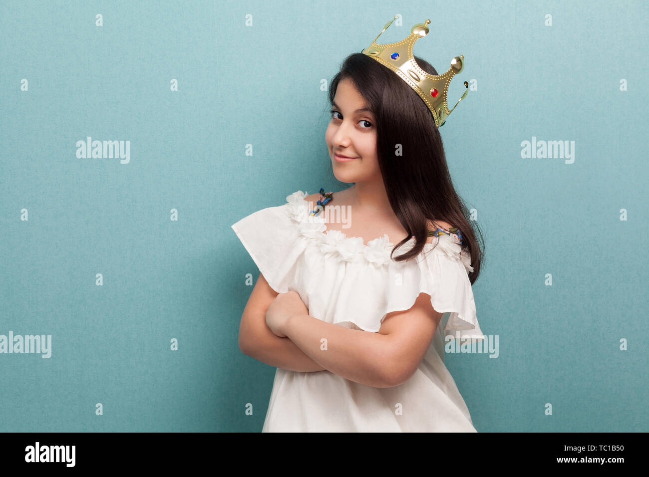 Portrait of young satisfied arrogance beautiful princess brunette girl ...