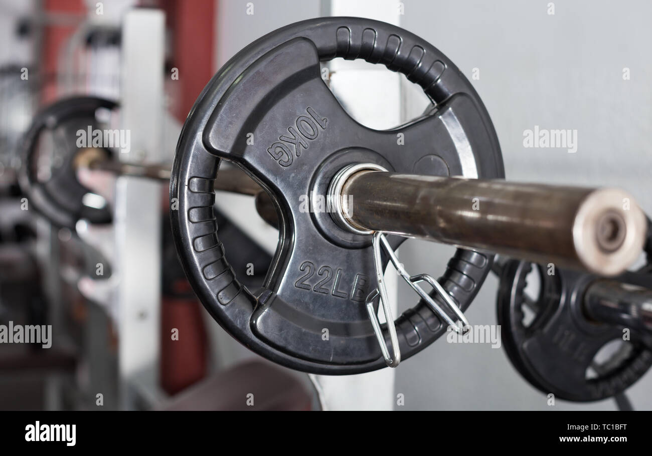 Closeup of weightlifting gear in modern gym interior Stock Photo - Alamy