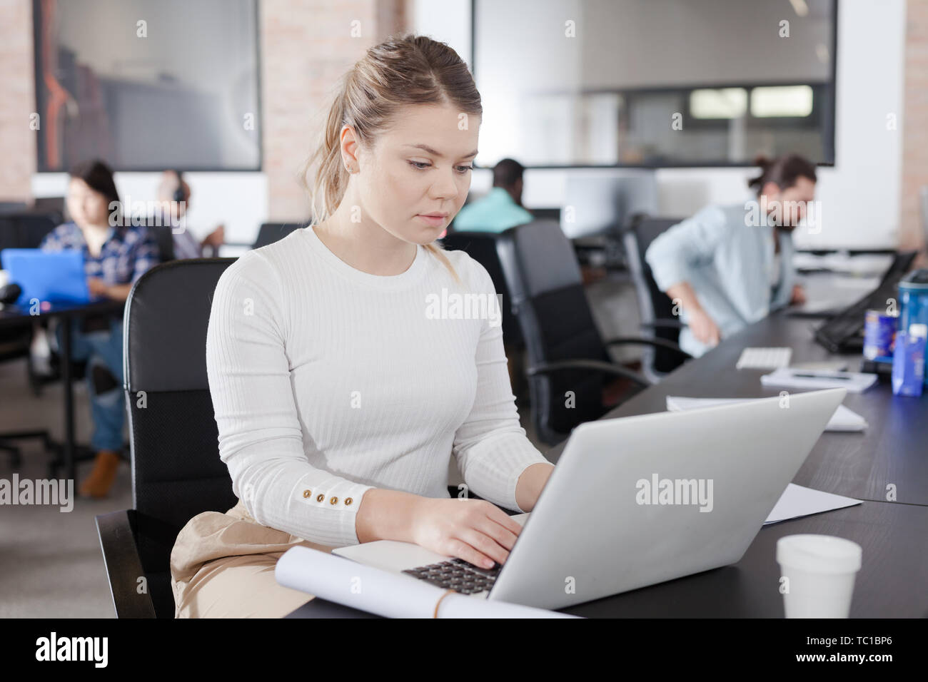Woman working busy open plan office hi-res stock photography and images ...