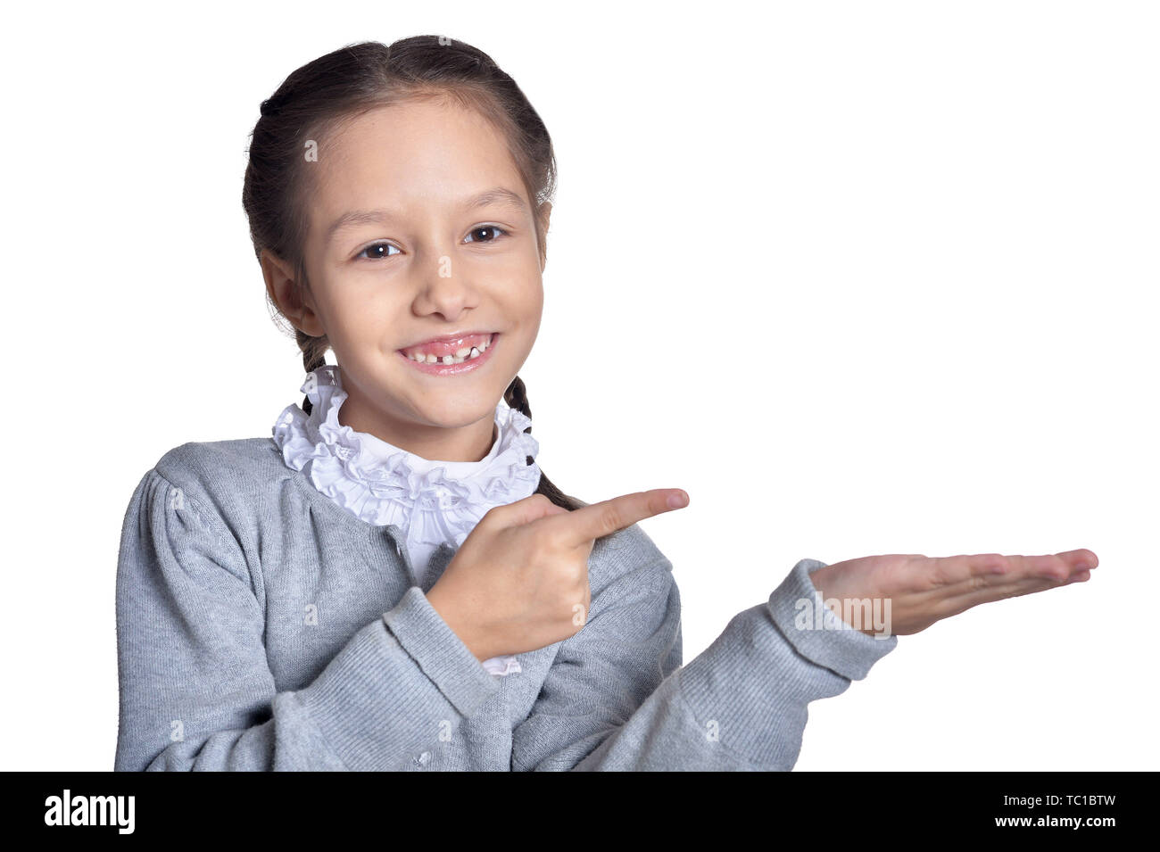 portrait of cute little girl pointing to the right Stock Photo - Alamy