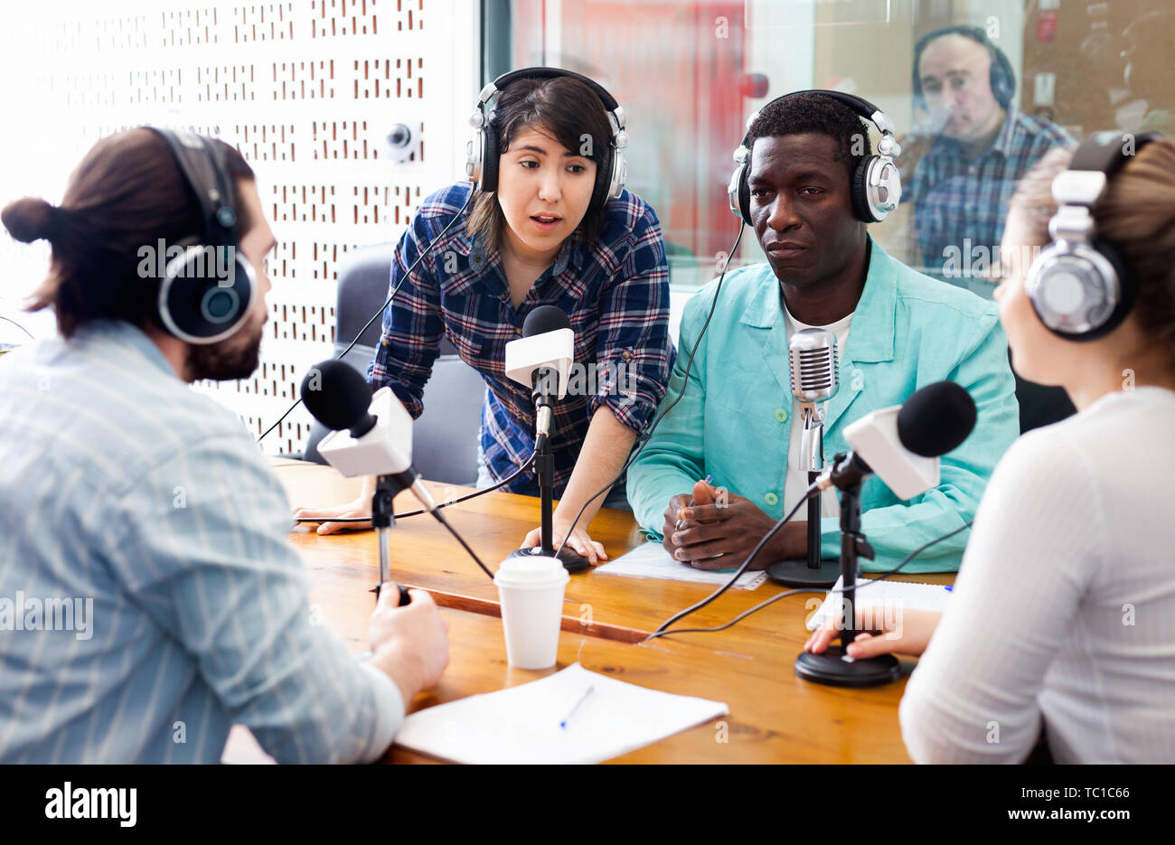 Scandal interview. Two young outraged guests answering provocative ...