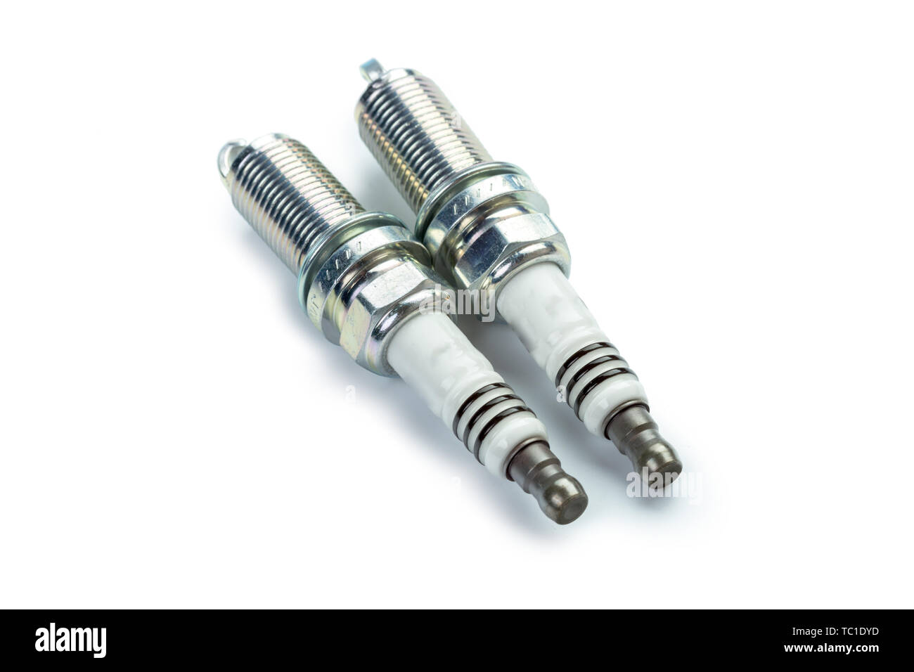 spark plugs isolated on white Stock Photo - Alamy