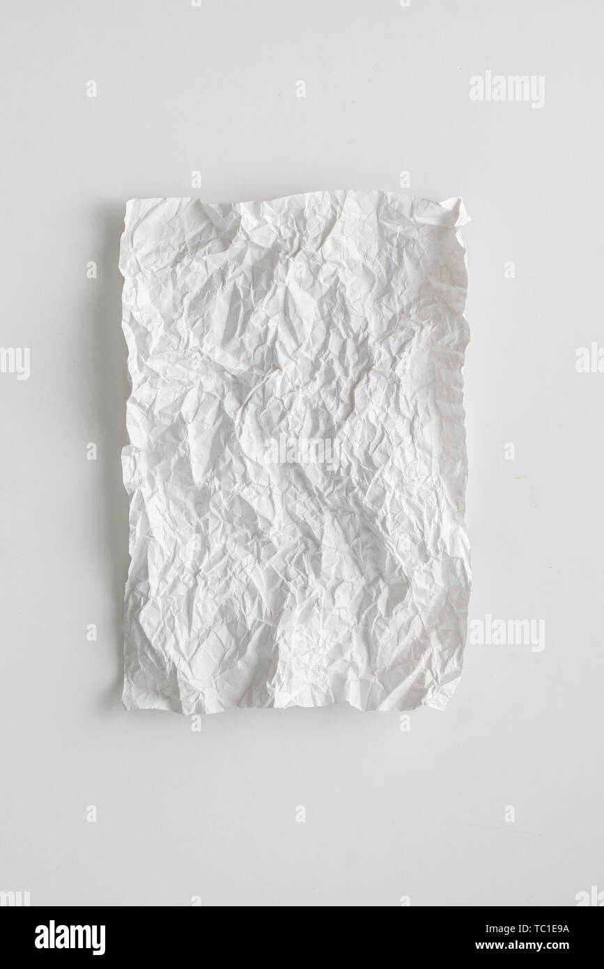 flat lay crumpled white paper sheet isolated on the table, background ...