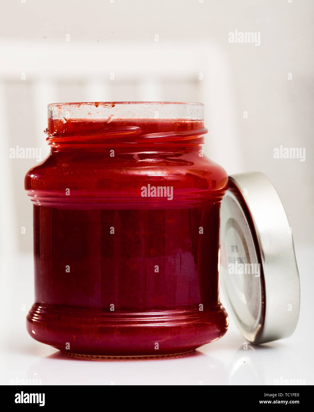 Strawberry jam in a glass jar Stock Photo - Alamy