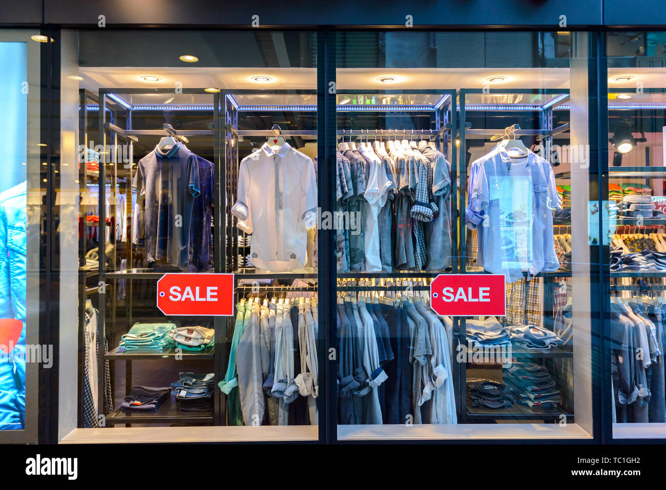 Sale word on shopfront display window Stock Photo - Alamy
