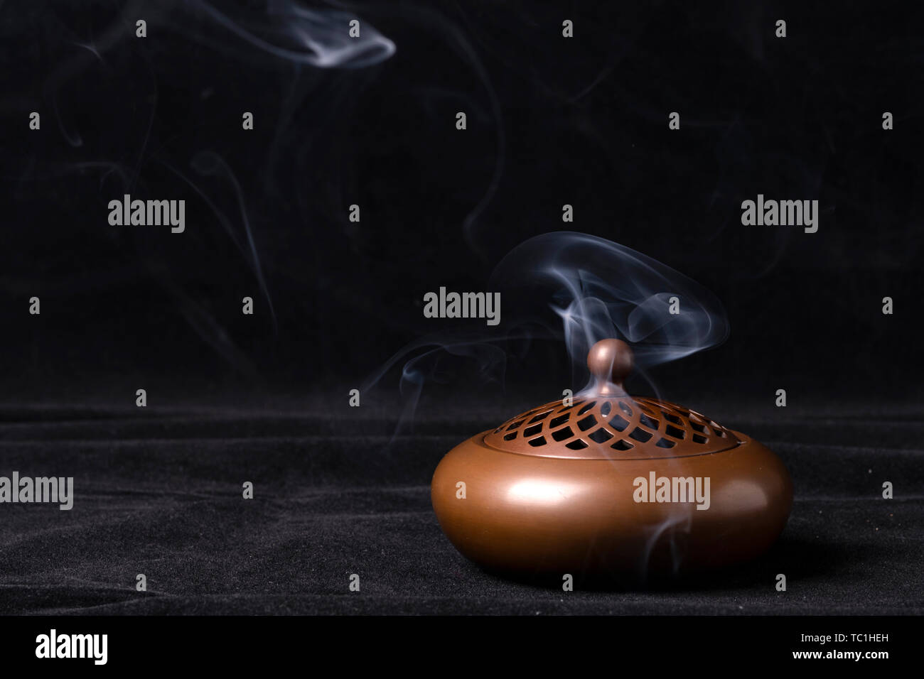 Copper incense stove Stock Photo - Alamy