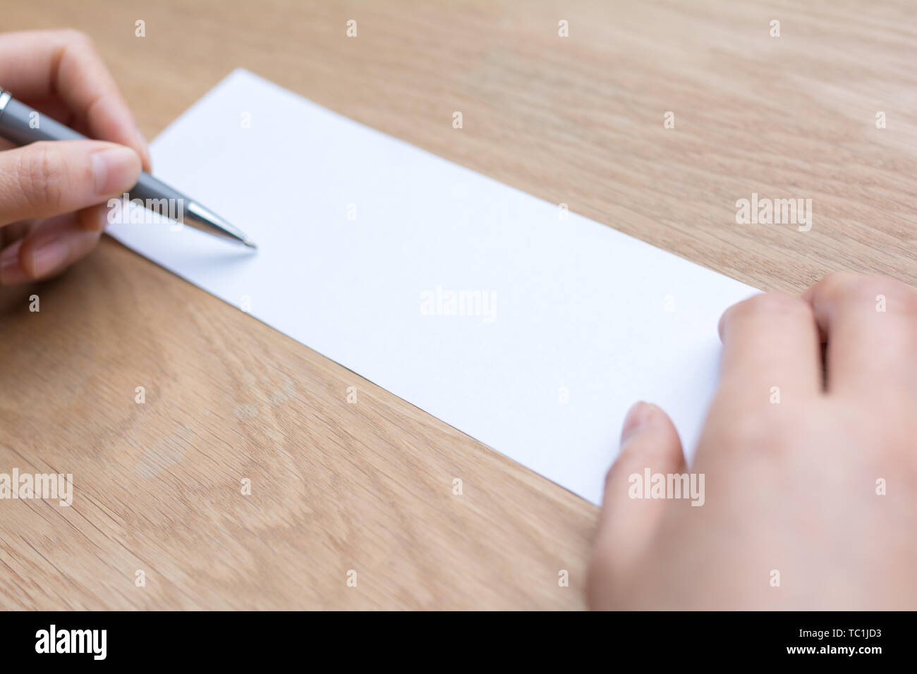 businessman writing on white paper Stock Photo - Alamy