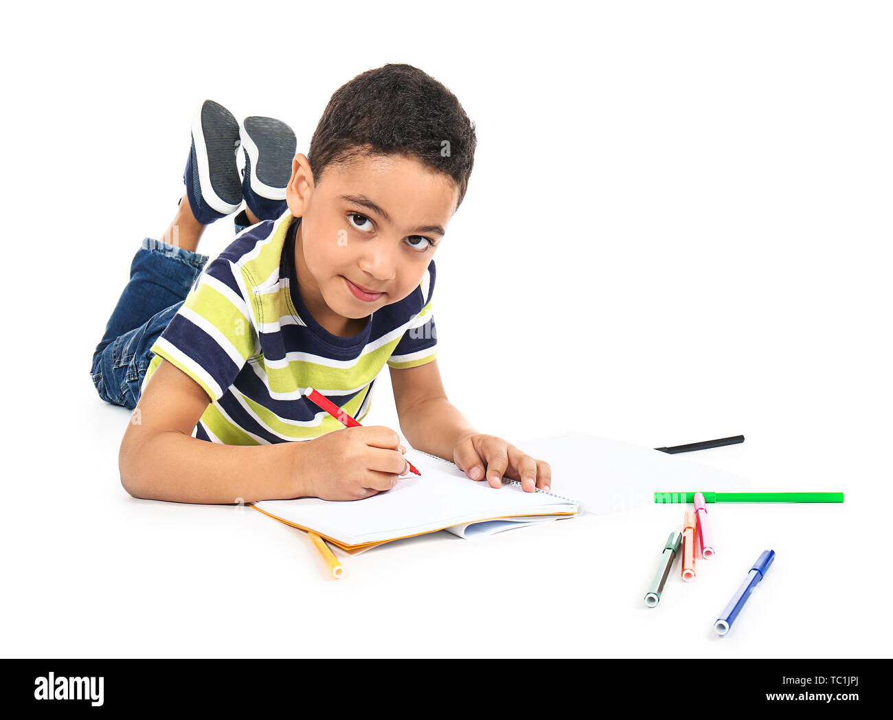 Portrait of cute little boy drawing picture on white background Stock ...