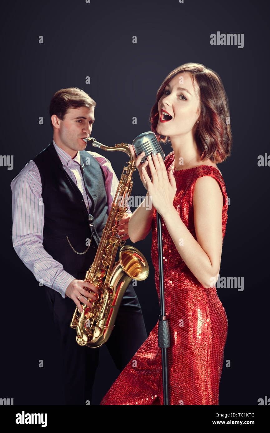 Female singer and saxophonist Stock Photo - Alamy