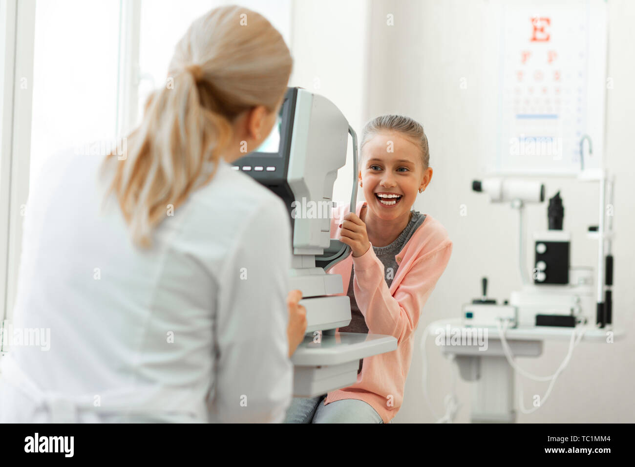Important appointment. Laughing pretty girl with tied hair having fun ...