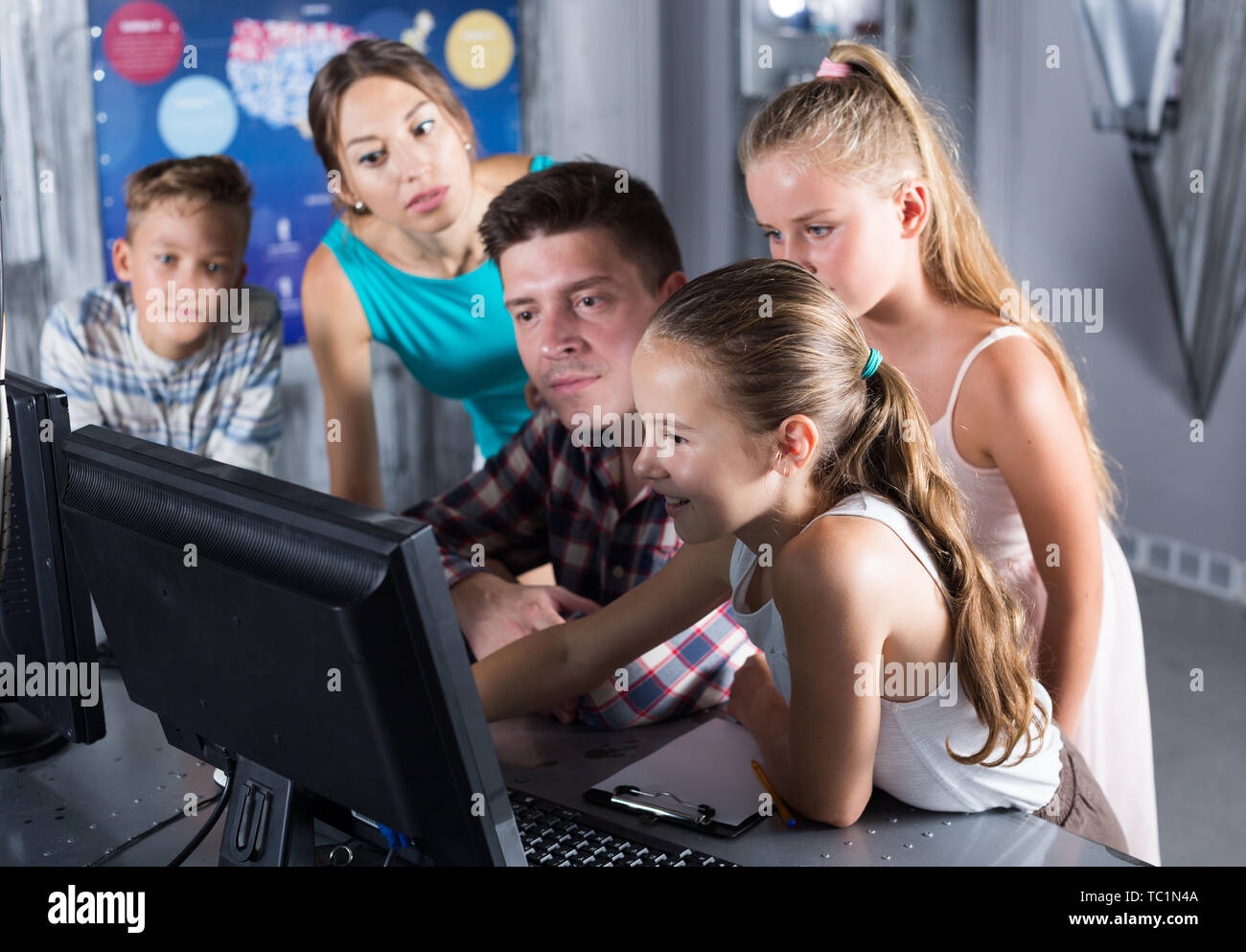 Portrait of family who is using computer in the lost room stylized ...
