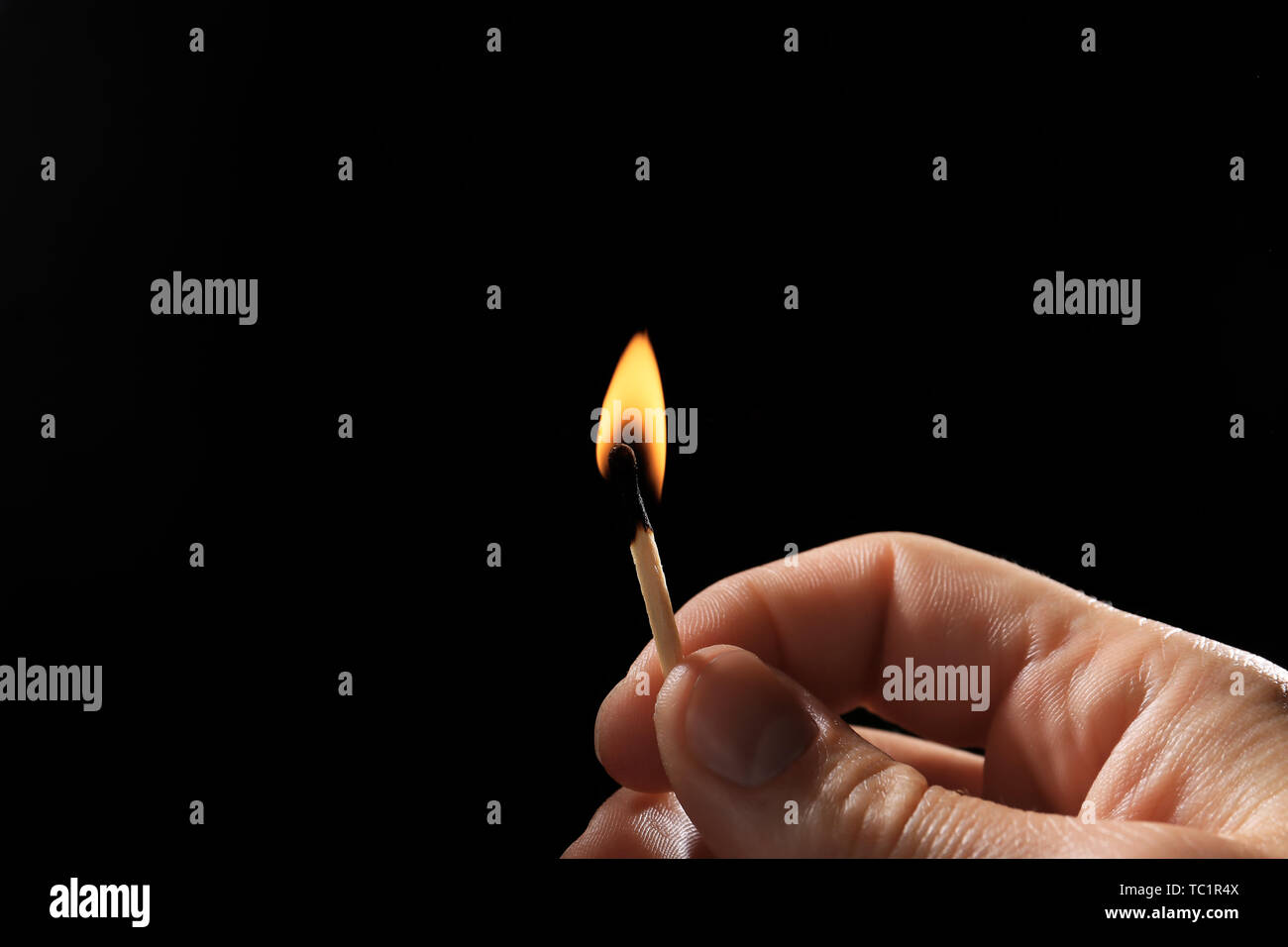 Person holding burning match hi-res stock photography and images - Alamy