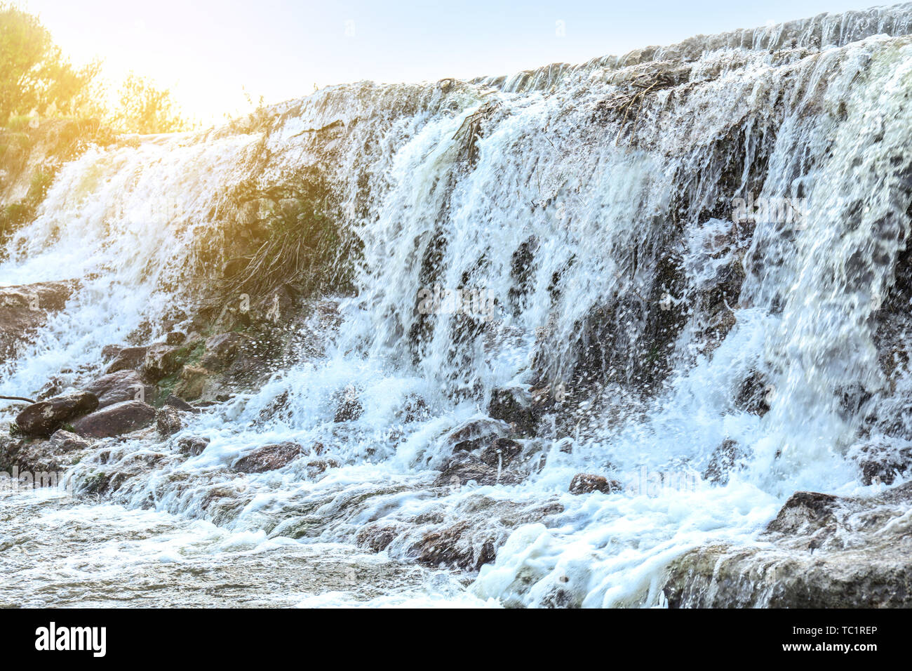Beautiful waterfall in countryside on summer day Stock Photo - Alamy