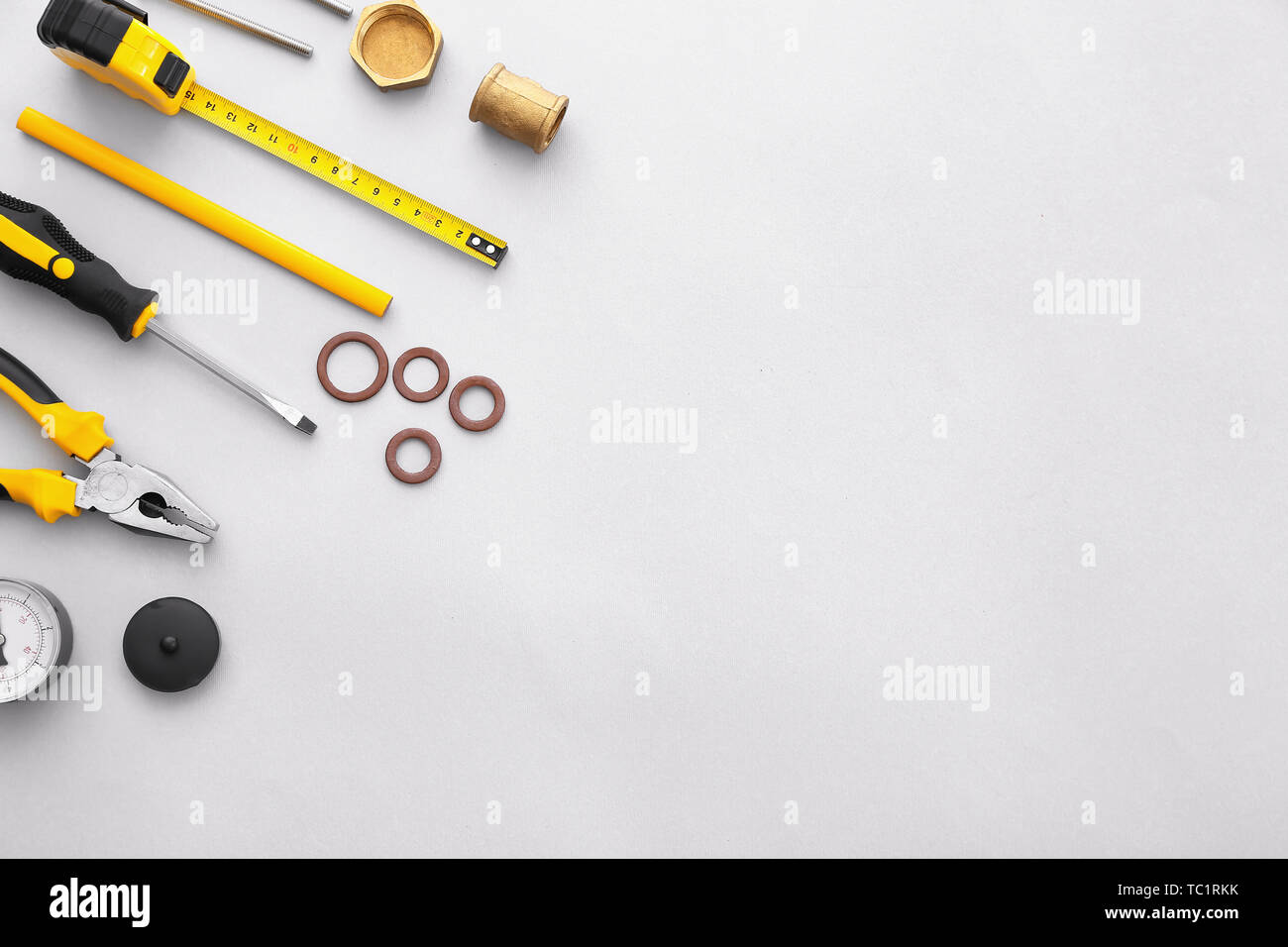 Set of plumber tools on white background Stock Photo - Alamy
