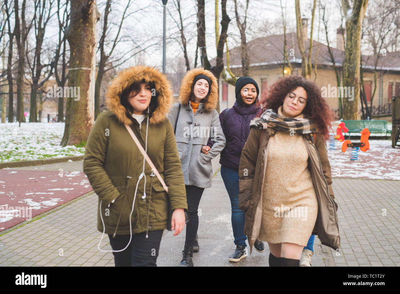 group of young multiracial women walking in park – friendship, vacation ...