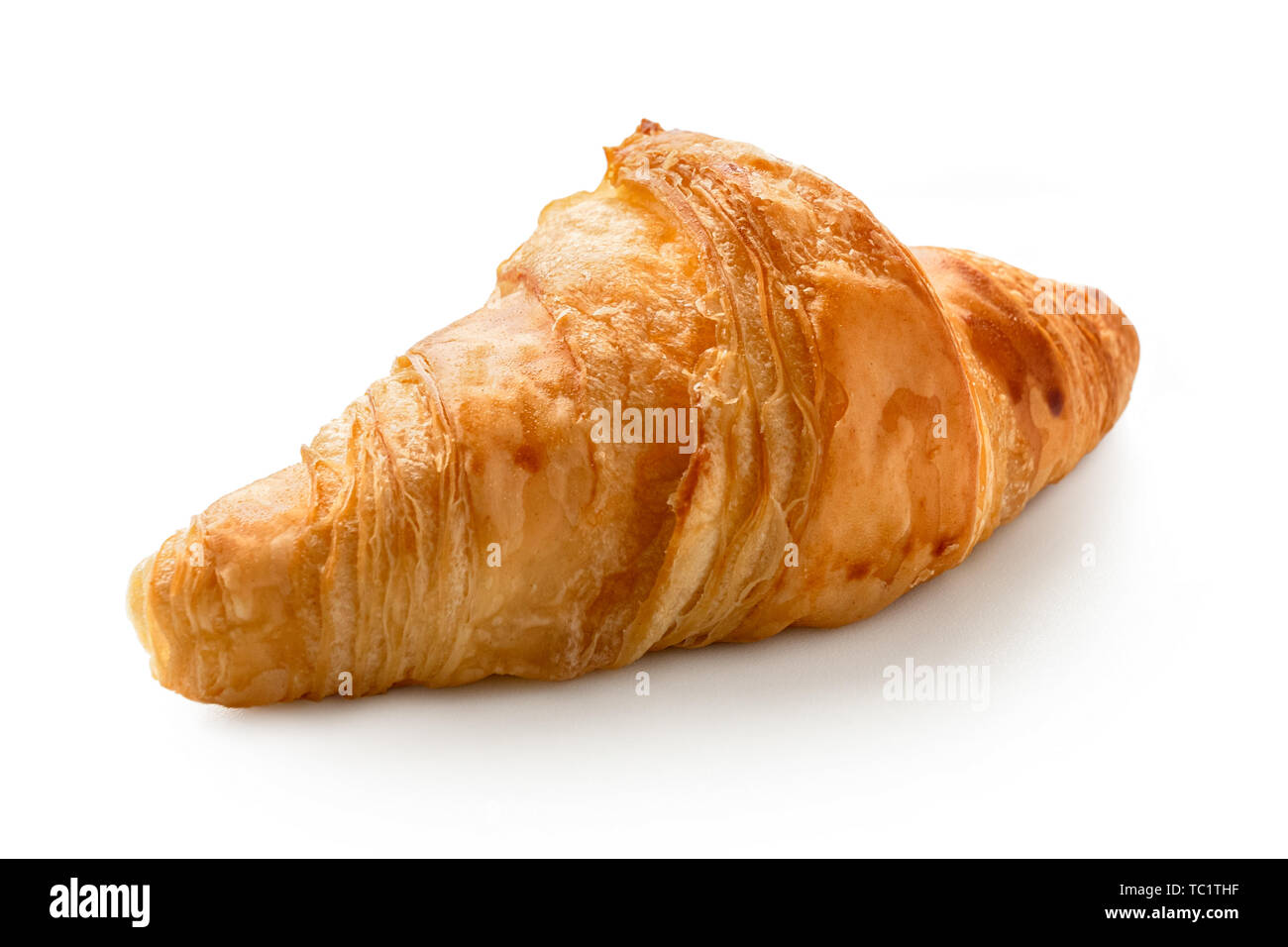 Single baked plain croissant isolated on white Stock Photo - Alamy