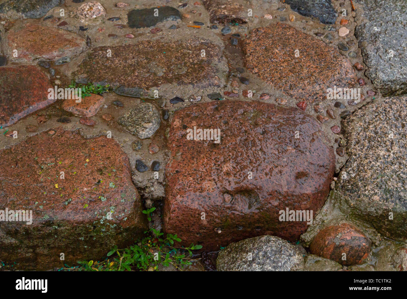 The road from big stone cobblestones after a rain Stock Photo - Alamy