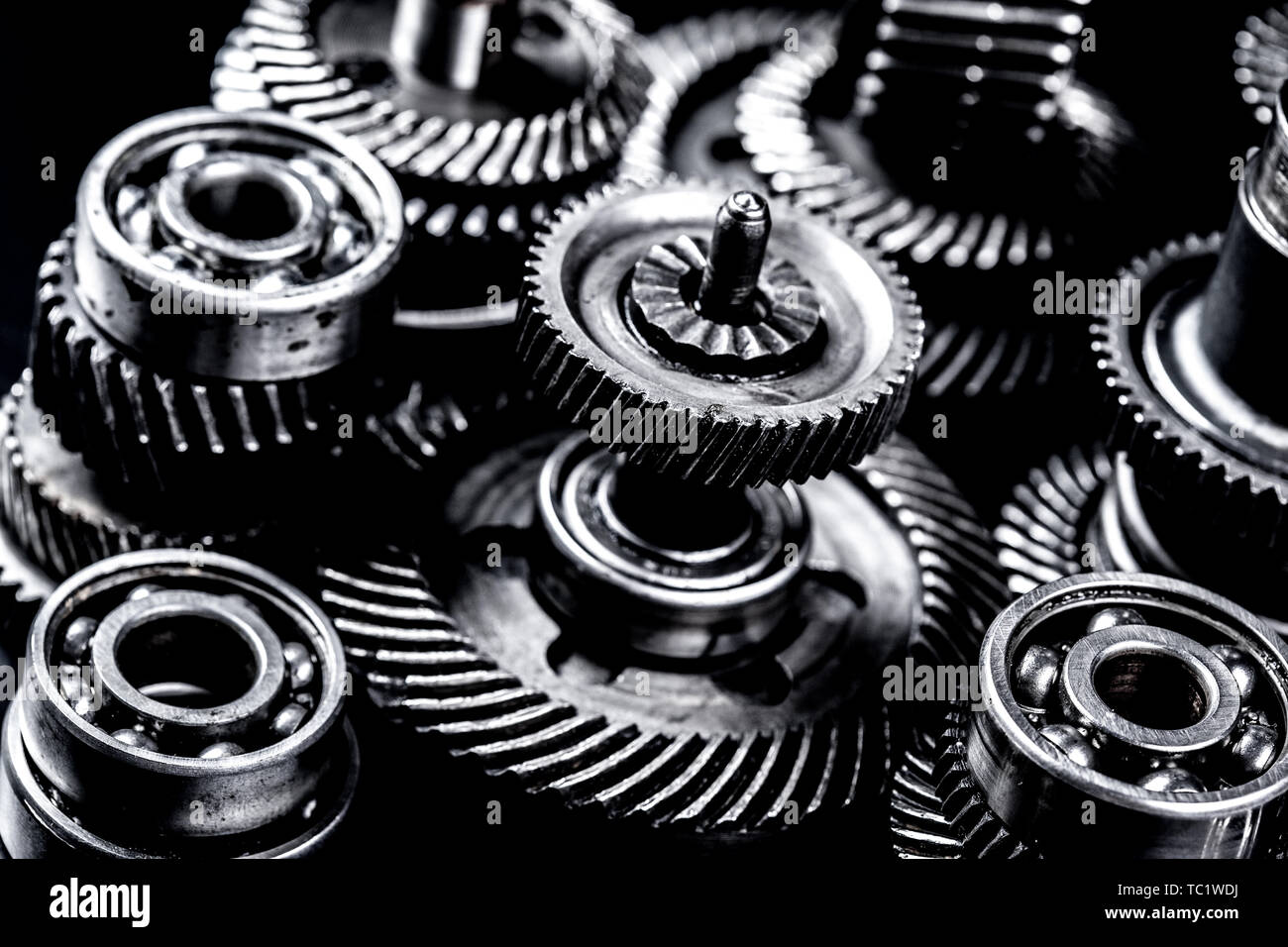 Metal gears on black background Stock Photo - Alamy