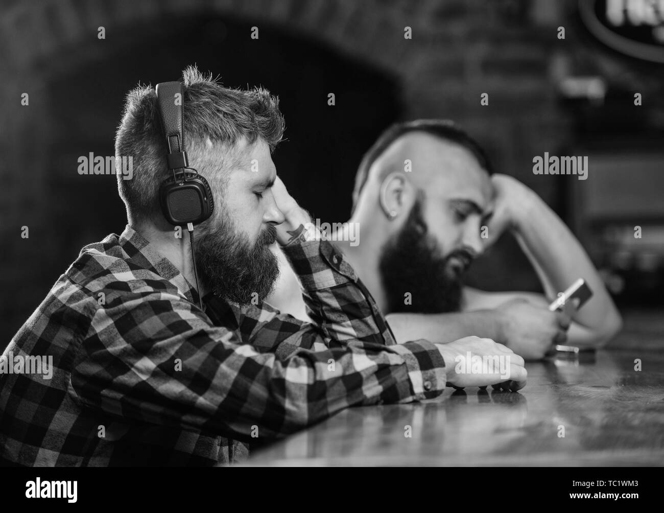 Friday relaxation in bar. Hipster bearded man spend leisure at bar ...