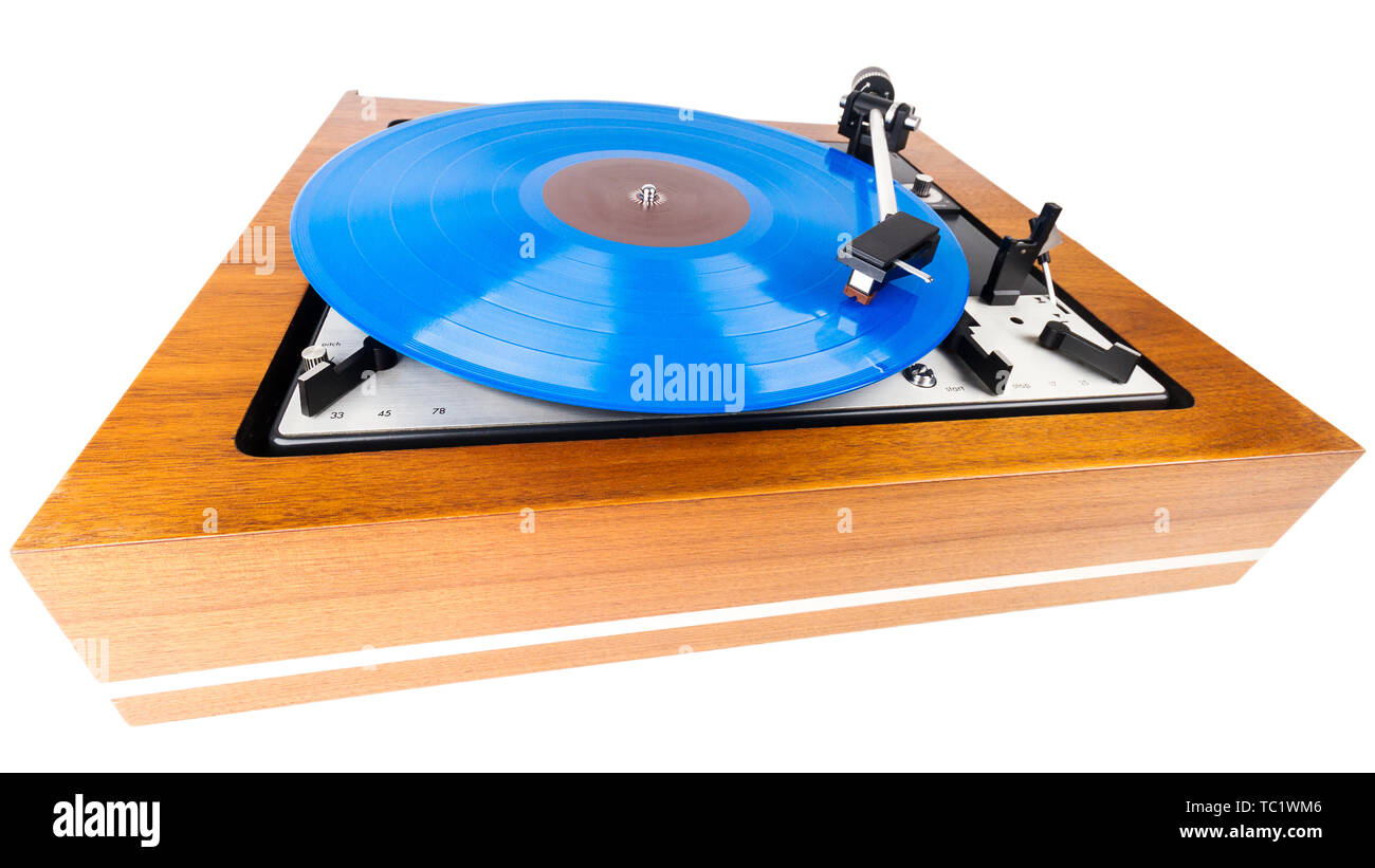 Vintage turntable with a blue vinyl isolated on white. Wooden plinth ...