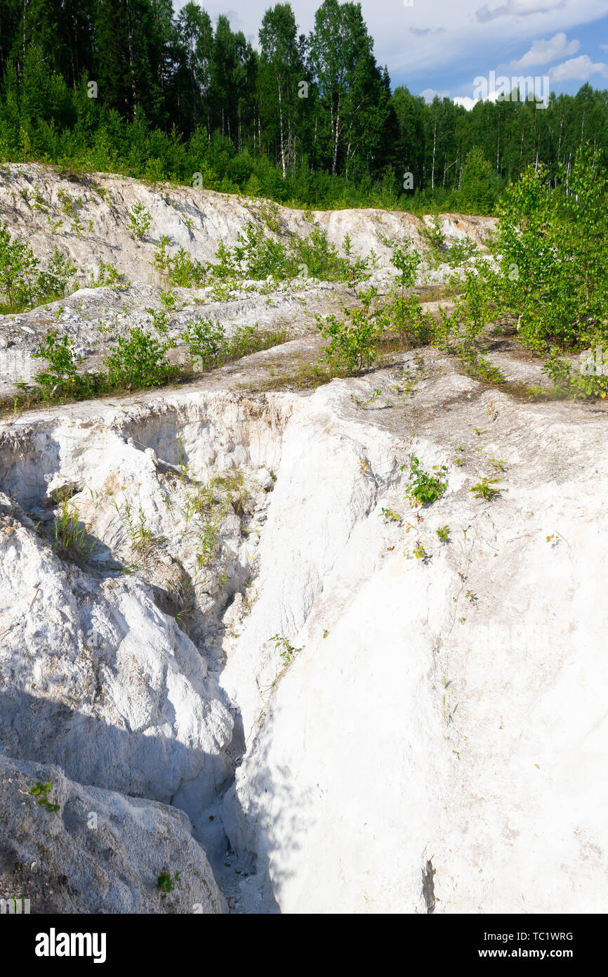 Extraction of talc in career. Abandoned white quarry in forest Stock ...