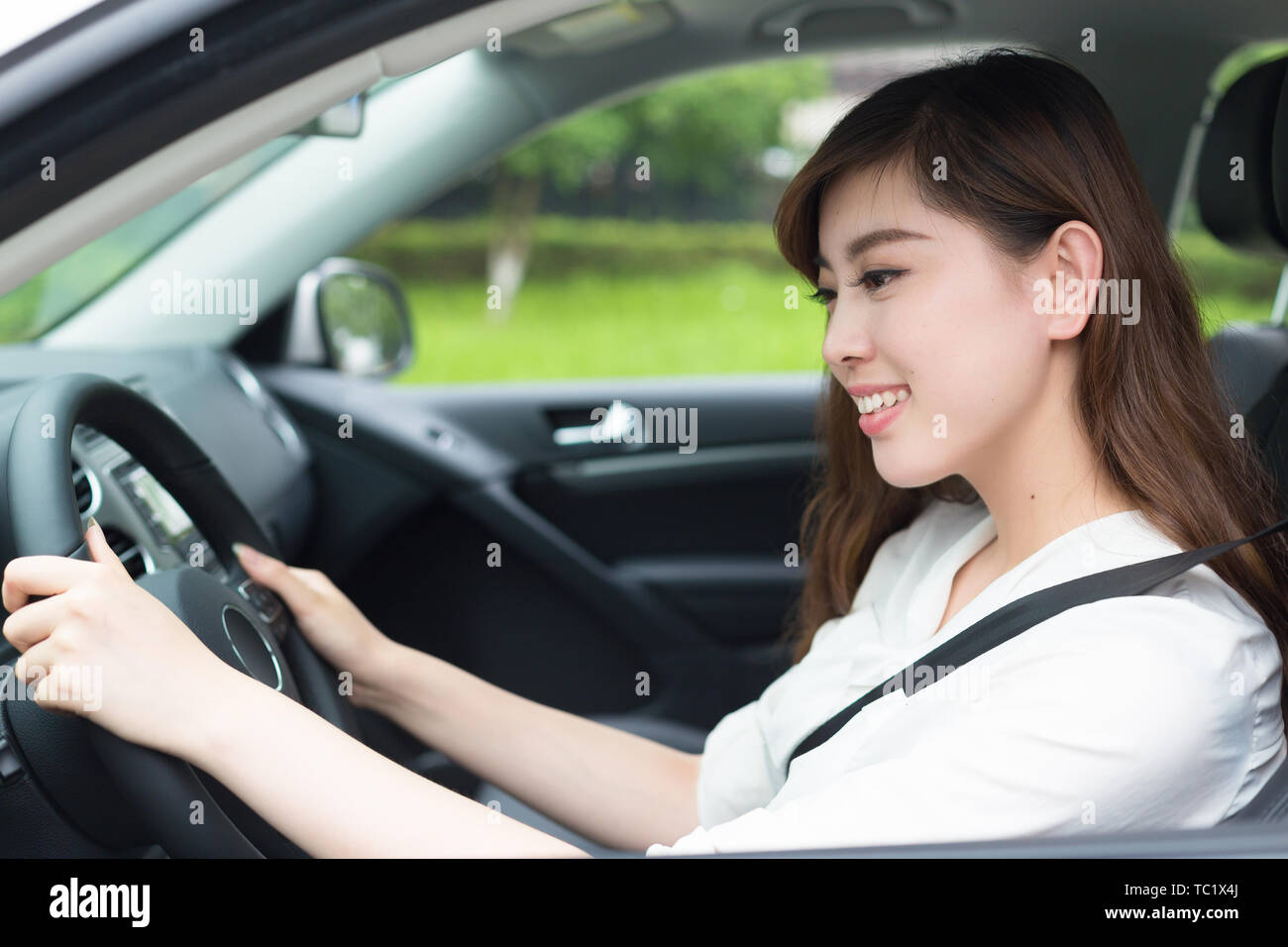 young beautiful asian girl in car Stock Photo - Alamy