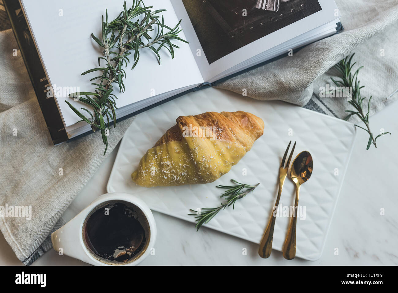 Breakfast afternoon tea, bread, milk coffee magazine Stock Photo - Alamy