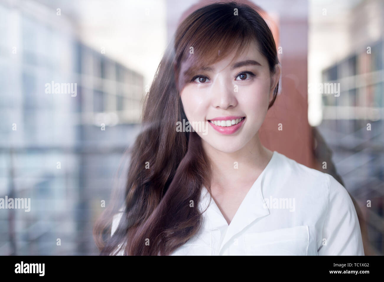 asian beautiful female student holding book in library portrait Stock ...