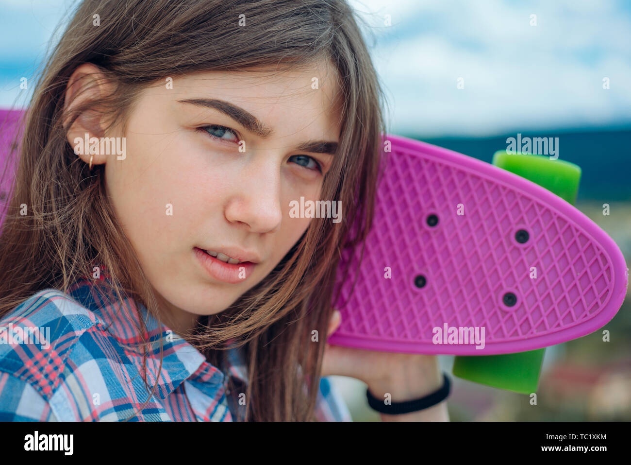 Hipster girl with penny board. Urban scene, city life. skateboard sport ...