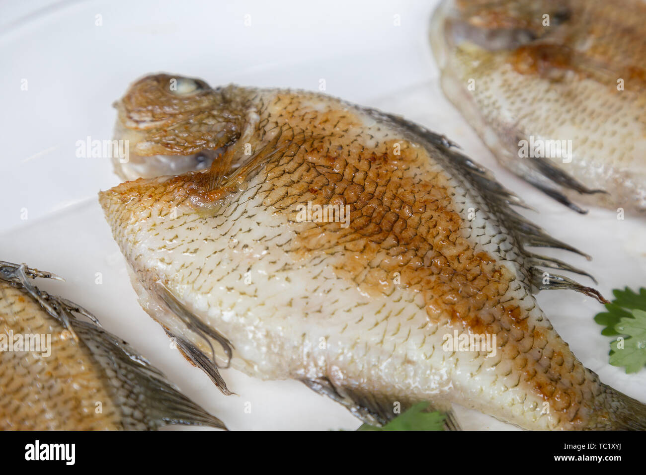 Chinese cuisine fried sunfish Stock Photo - Alamy