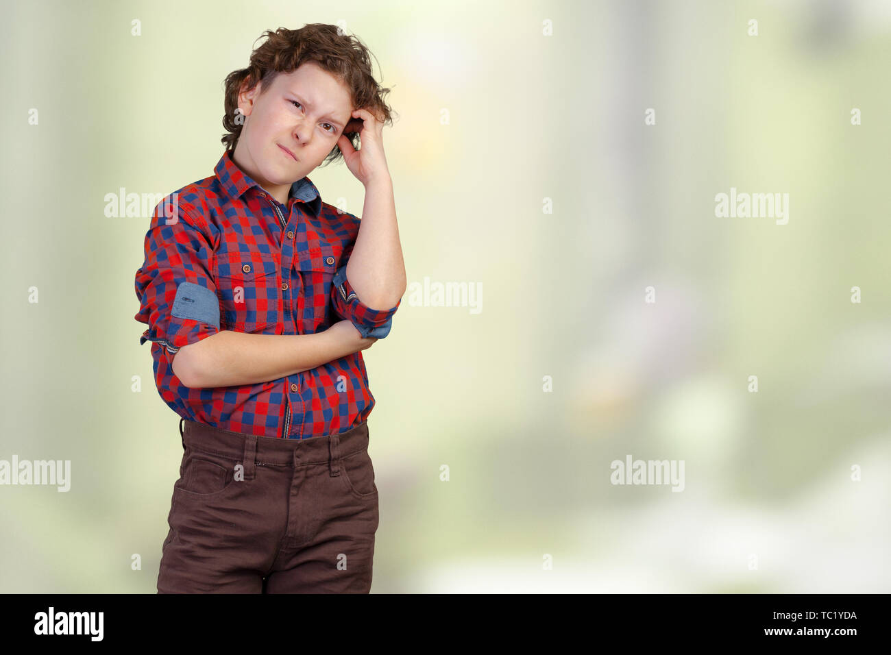 cute young boy thinking Stock Photo - Alamy
