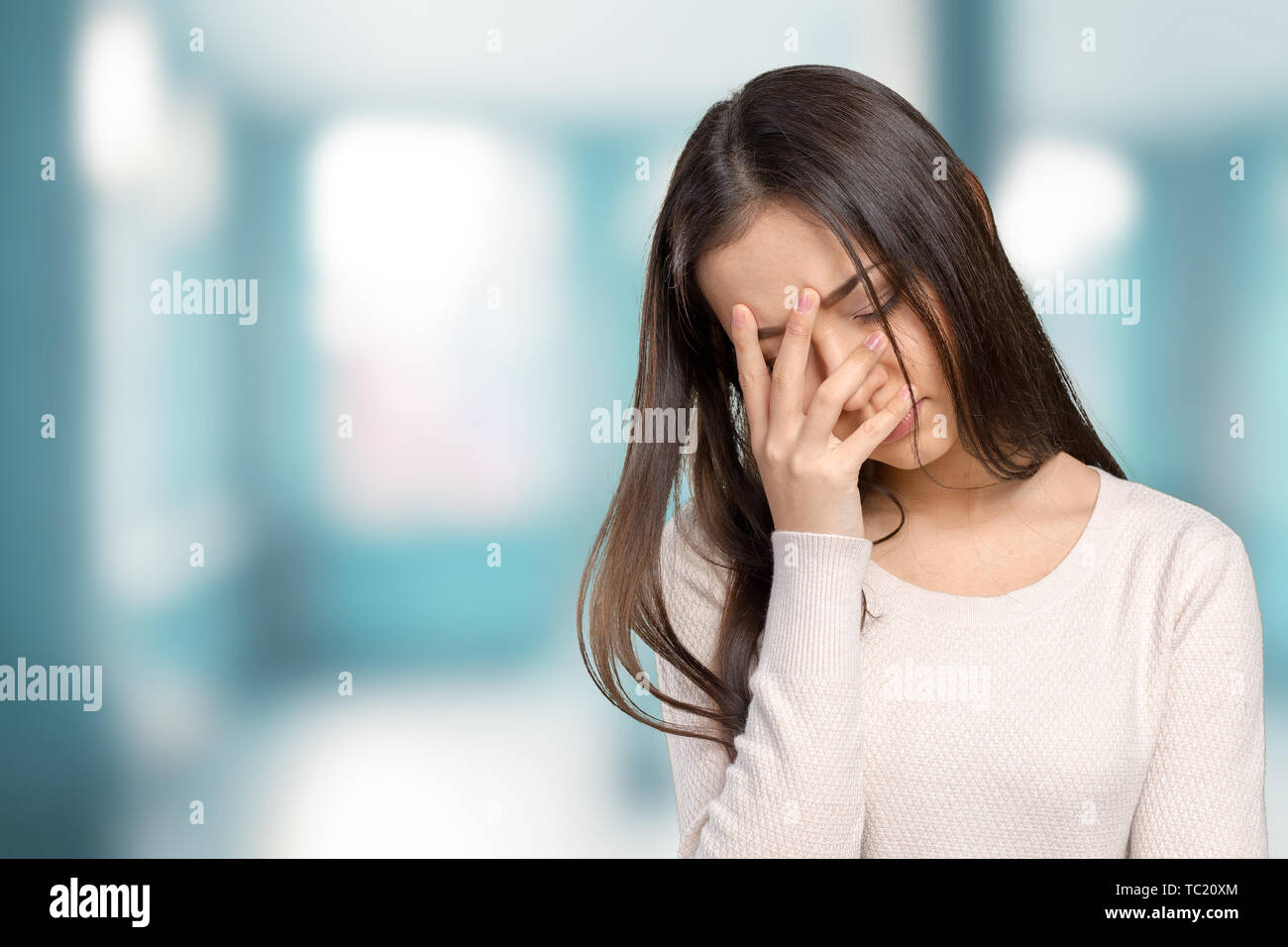 Portrait stressed sad young woman standing Stock Photo - Alamy