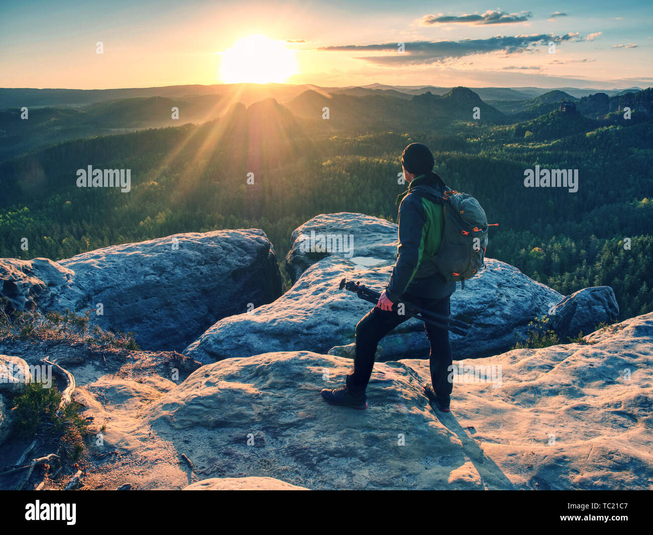 Photographer or videographer traveler thinking and set tripod for ...