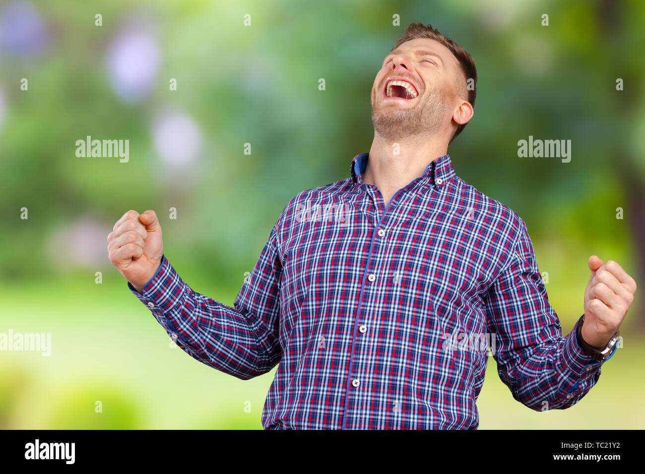Successful businessman with arms up celebrating his victory Stock Photo ...