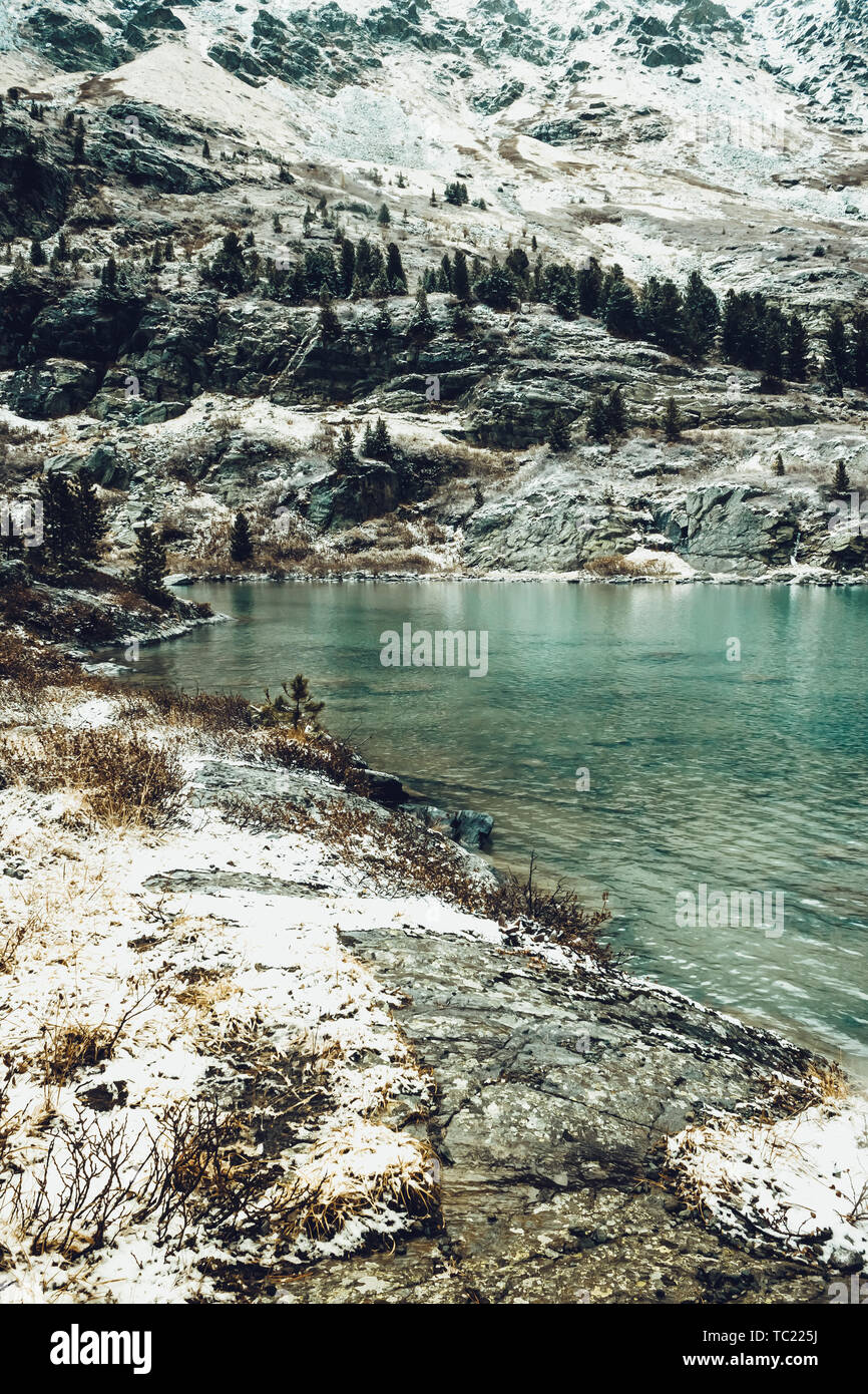 Mountain lake, rocks are reflected in water surface Stock Photo - Alamy