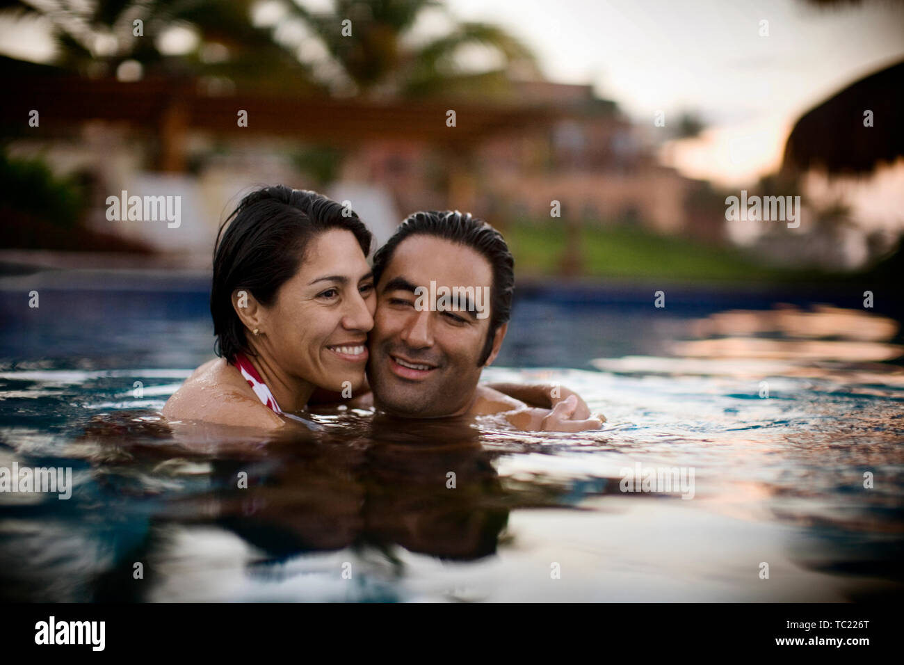 Couple hugging in swimming hi-res stock photography and images - Alamy