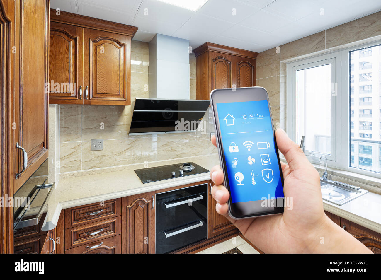 smart phone with smart home with modern kitchen Stock Photo - Alamy