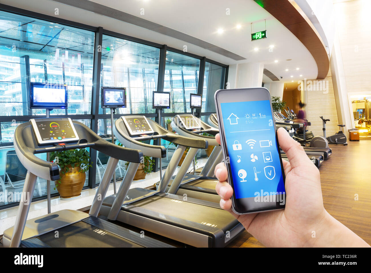 smart phone with smart home with modern gym Stock Photo - Alamy