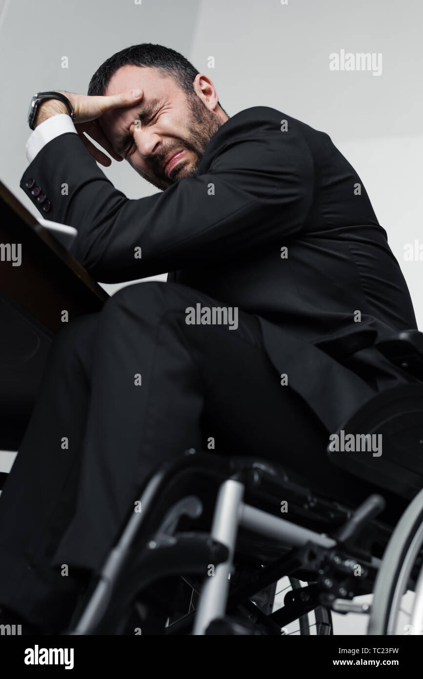 Depressed crying man in black hi-res stock photography and images - Alamy