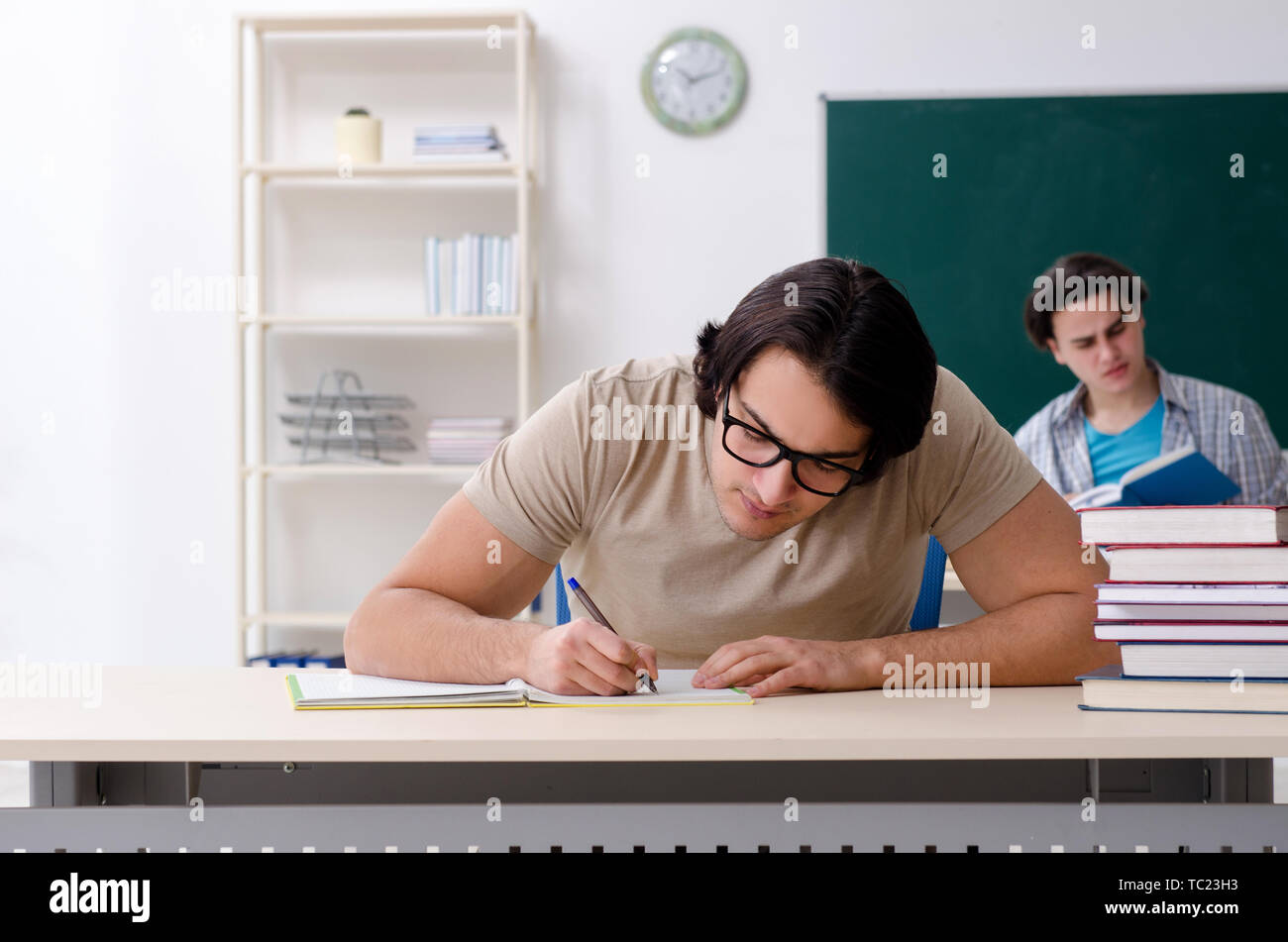 Two male students in the classroom Stock Photo - Alamy