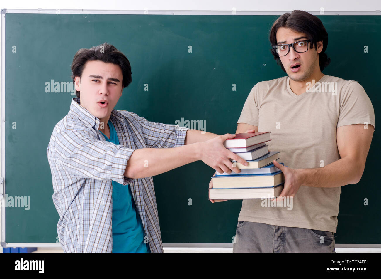 Two male students in the classroom Stock Photo - Alamy