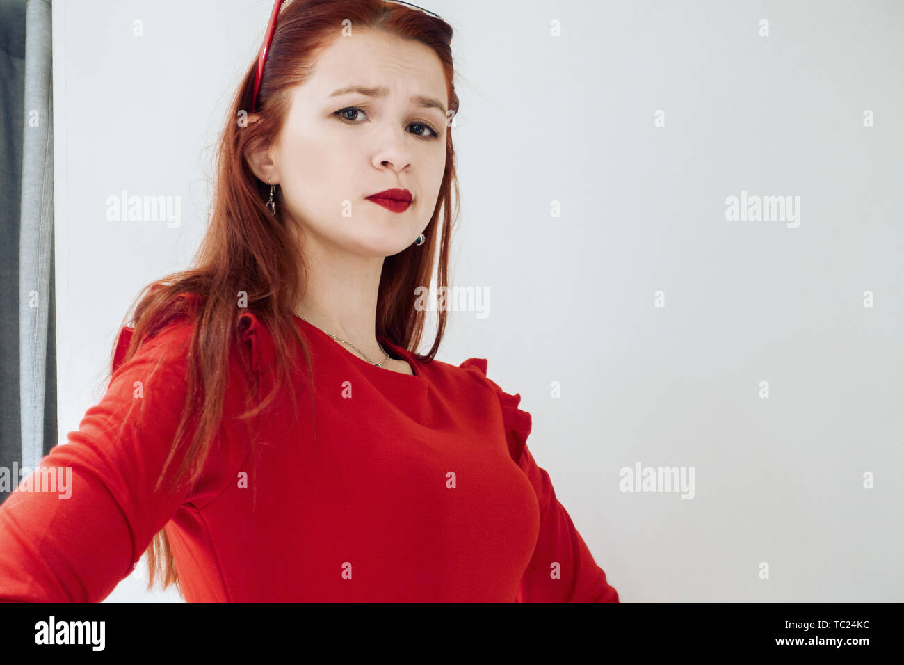 angry girl. young woman unhappy shows emotion. pouted her lips with red ...