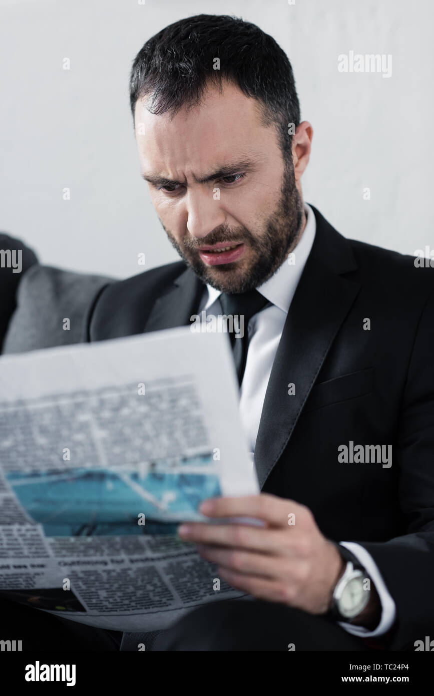 Shocked businessman reading newspaper hi-res stock photography and ...