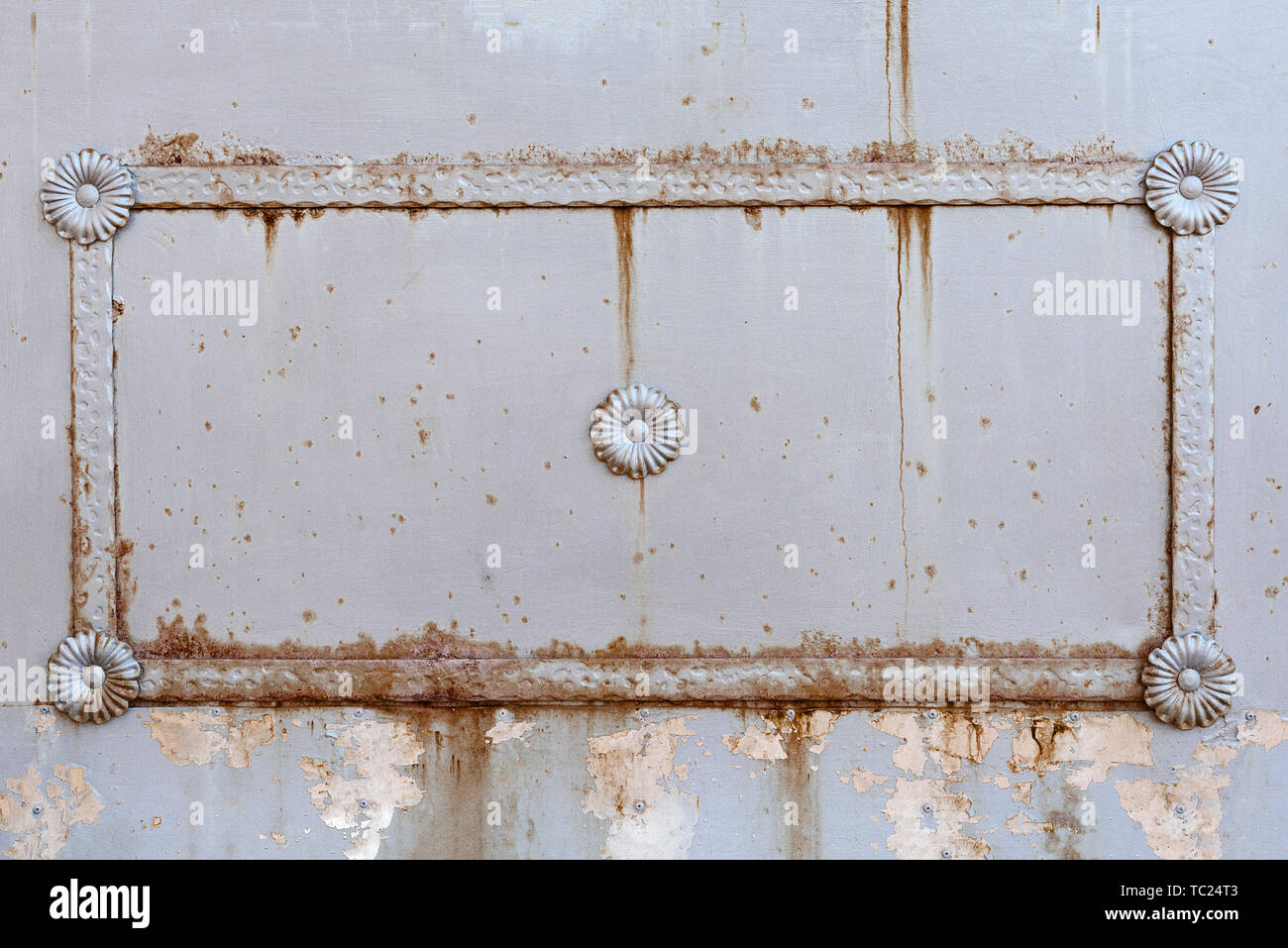 rectangular metal frame with pattern on rusty wall. fence. background ...