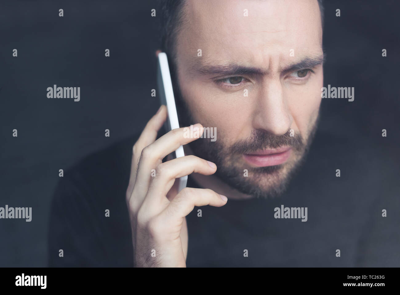 Sad handsome bearded man hi-res stock photography and images - Alamy