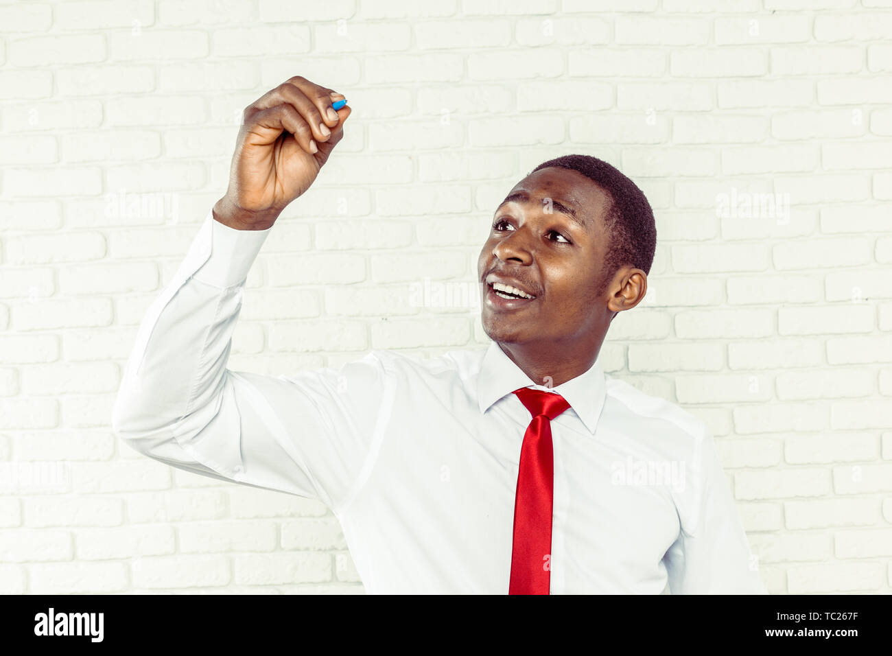Attractive african american man writing hi-res stock photography and ...